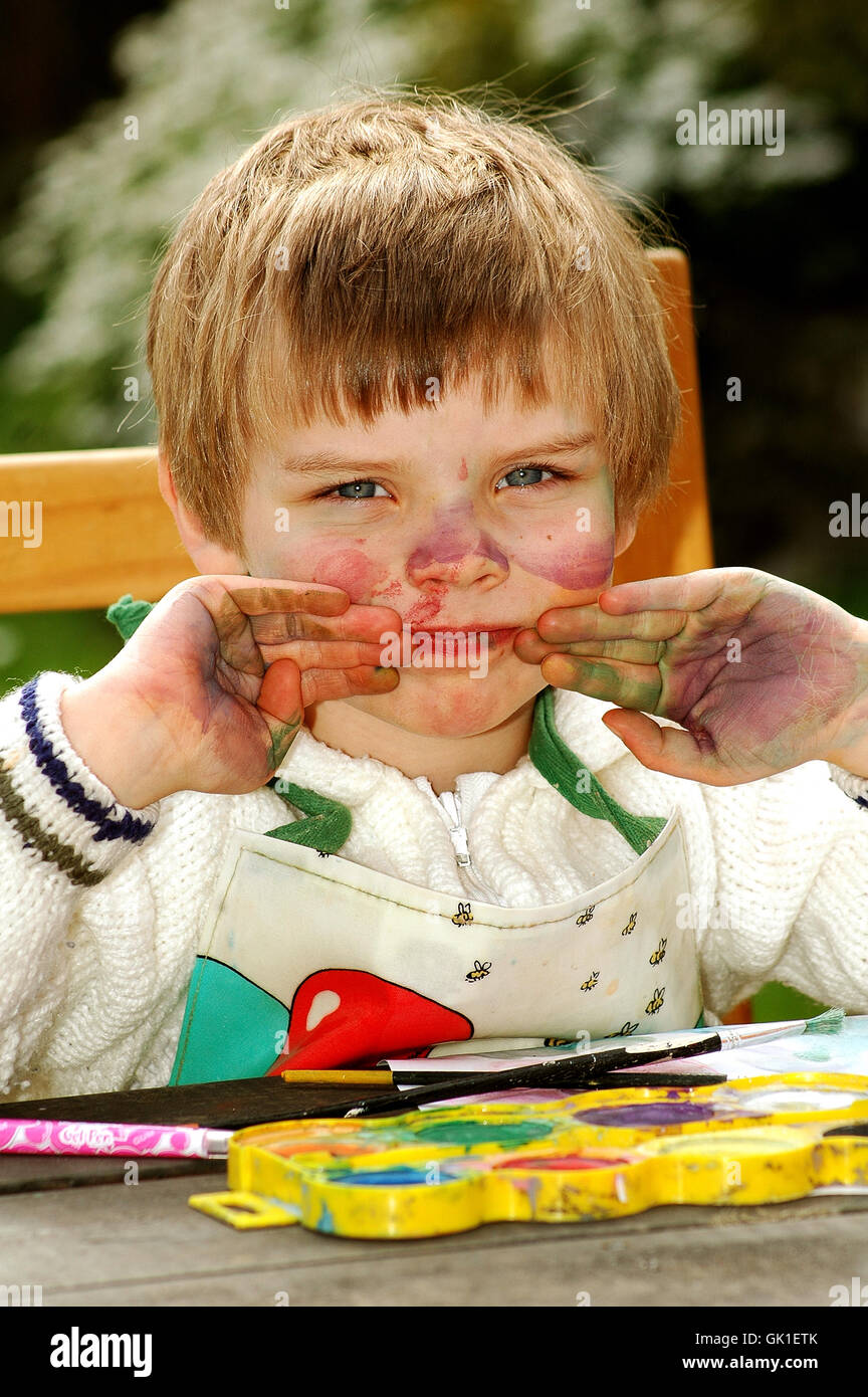 Child showing their mucky hands after painting them Stock Photo - Alamy