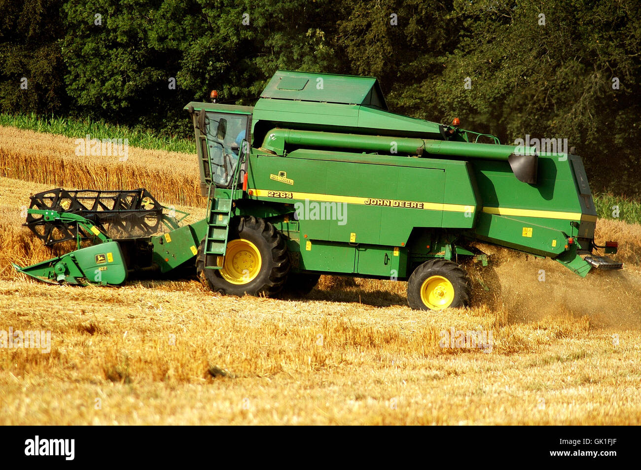 Combine harvester cutting the crop Stock Photo - Alamy