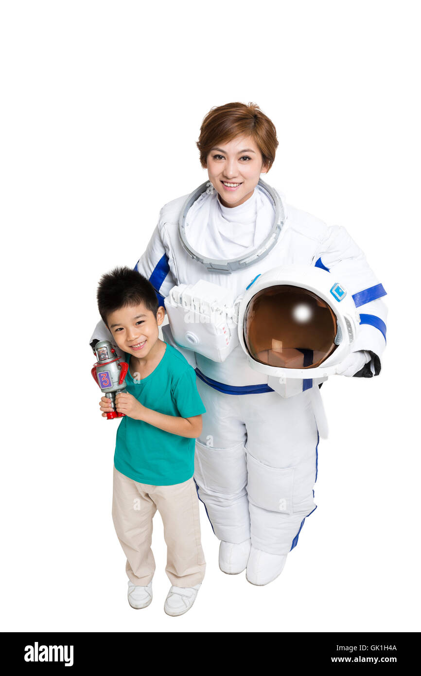 Studio shot astronauts and the little boy Stock Photo - Alamy