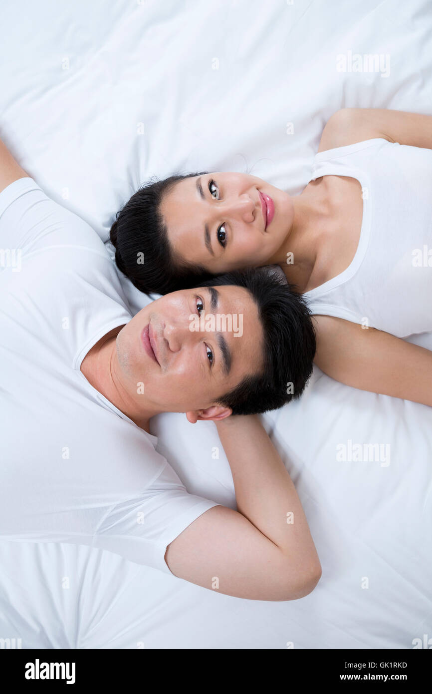 Couple in the bedroom intimacy Stock Photo - Alamy