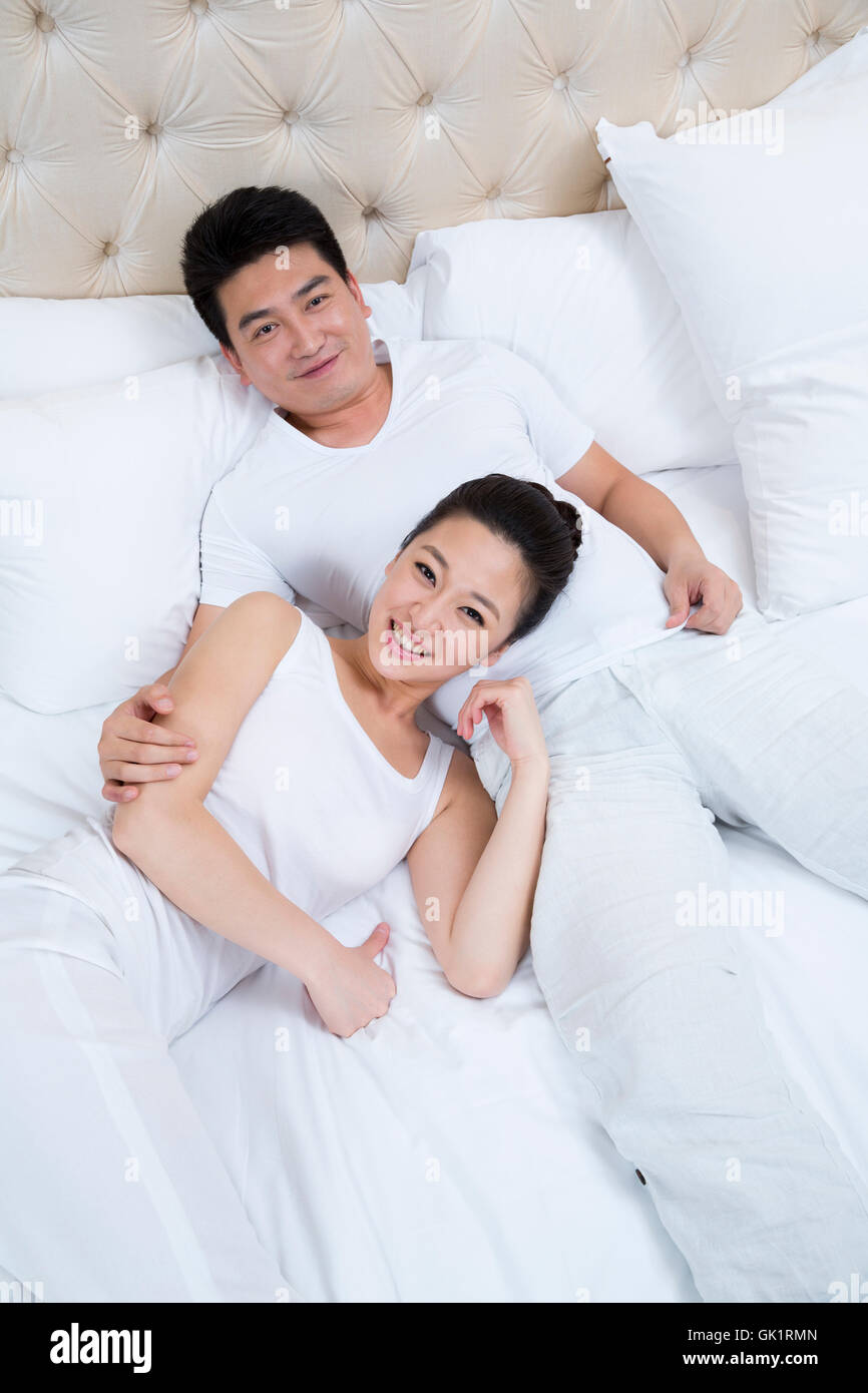 Couple in the bedroom intimacy Stock Photo - Alamy
