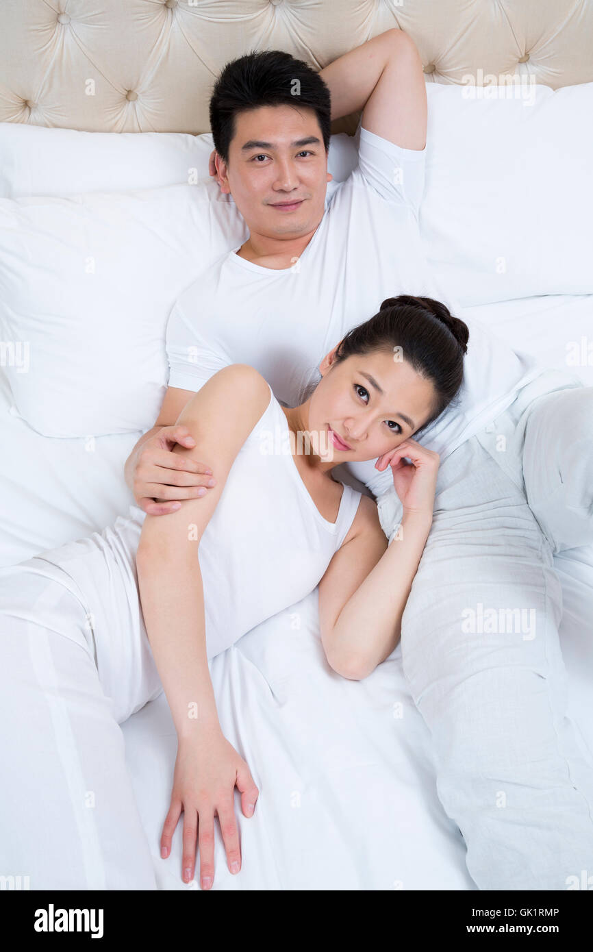 Couple in the bedroom intimacy Stock Photo - Alamy