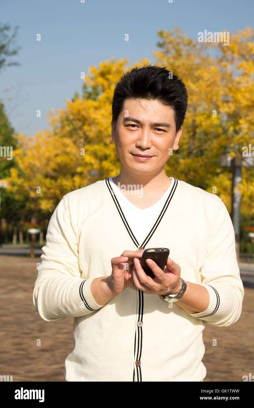 Middle-aged man in the garden of rest Stock Photo - Alamy