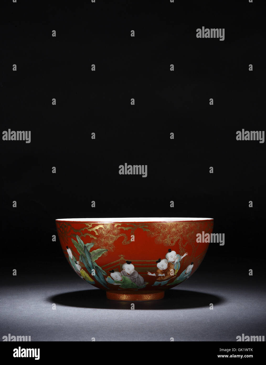 Red color Bowl gilt children at play Stock Photo - Alamy