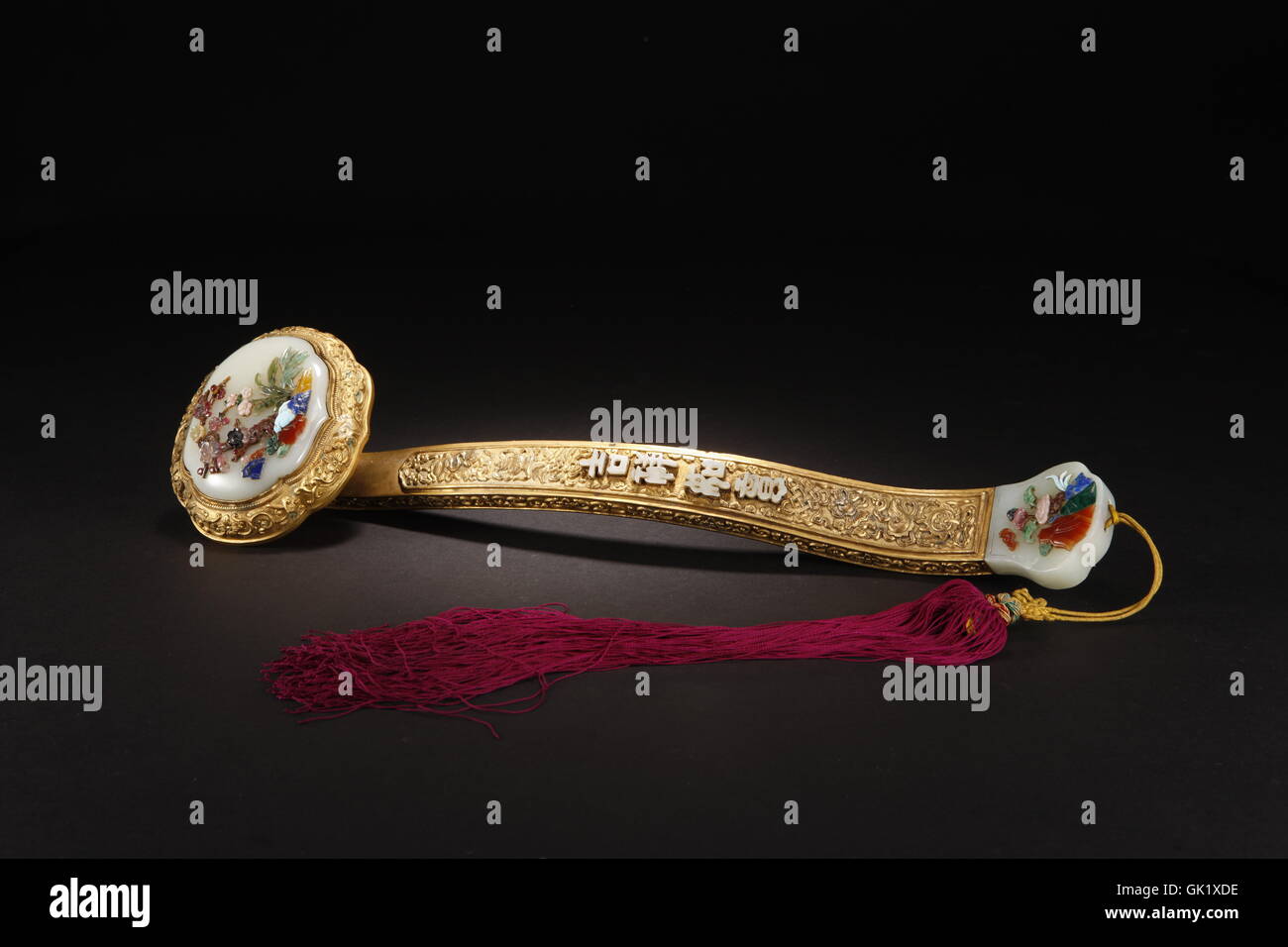 Gilt jade inlay luck Stock Photo - Alamy