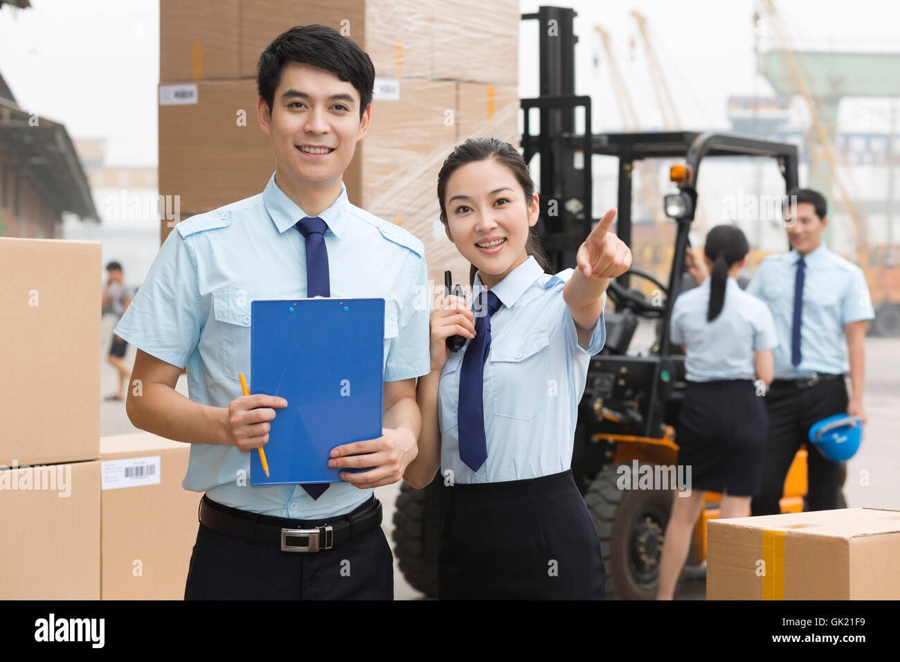 Logistics warehouse manager in communication Stock Photo - Alamy