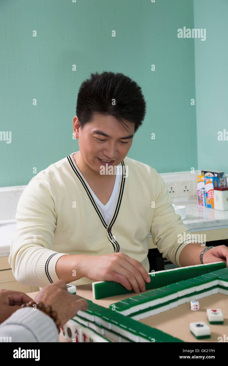 A people playing mahjong Stock Photo - Alamy