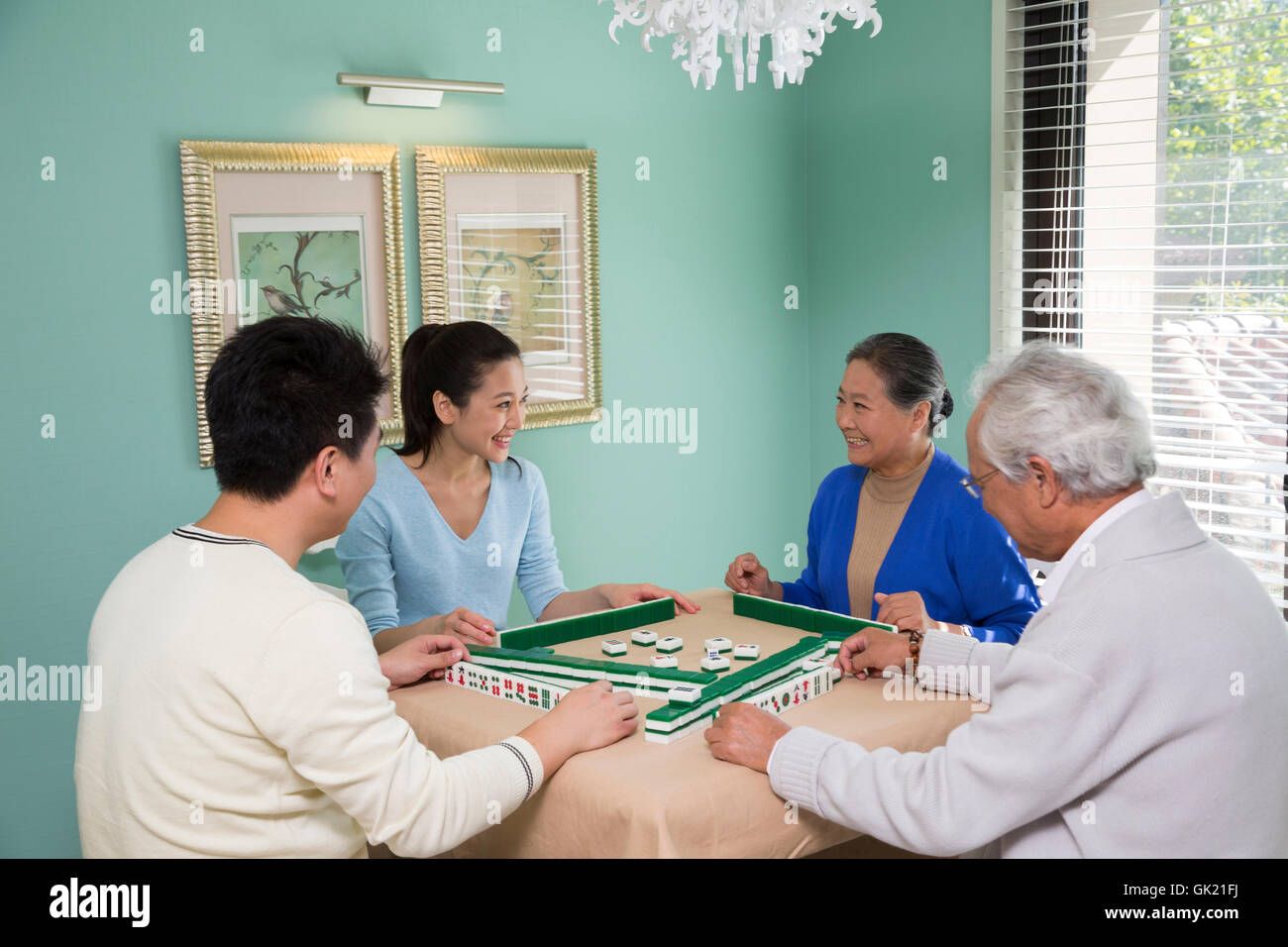 A people playing mahjong Stock Photo - Alamy