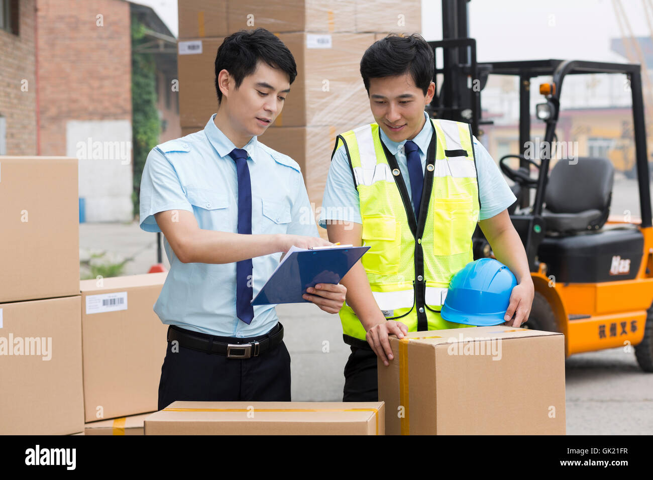 Logistics warehouse manager in communication Stock Photo - Alamy