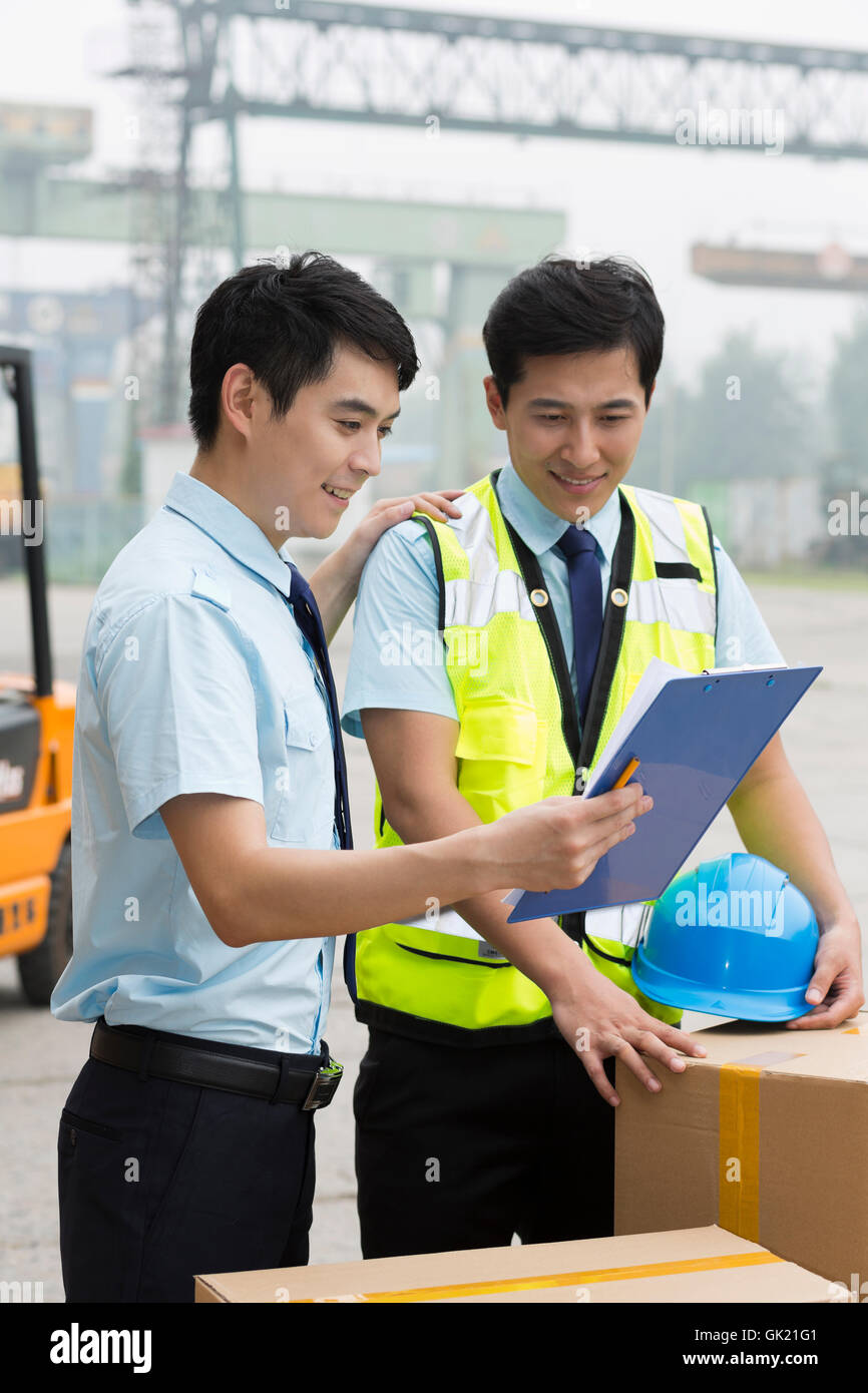 Logistics warehouse manager in communication Stock Photo - Alamy