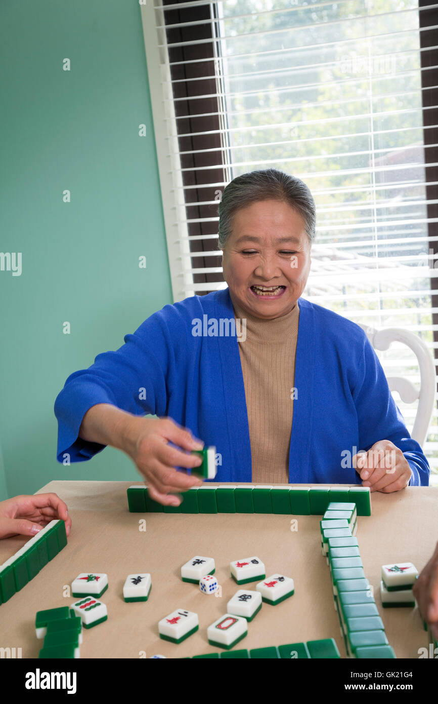 A people playing mahjong Stock Photo - Alamy