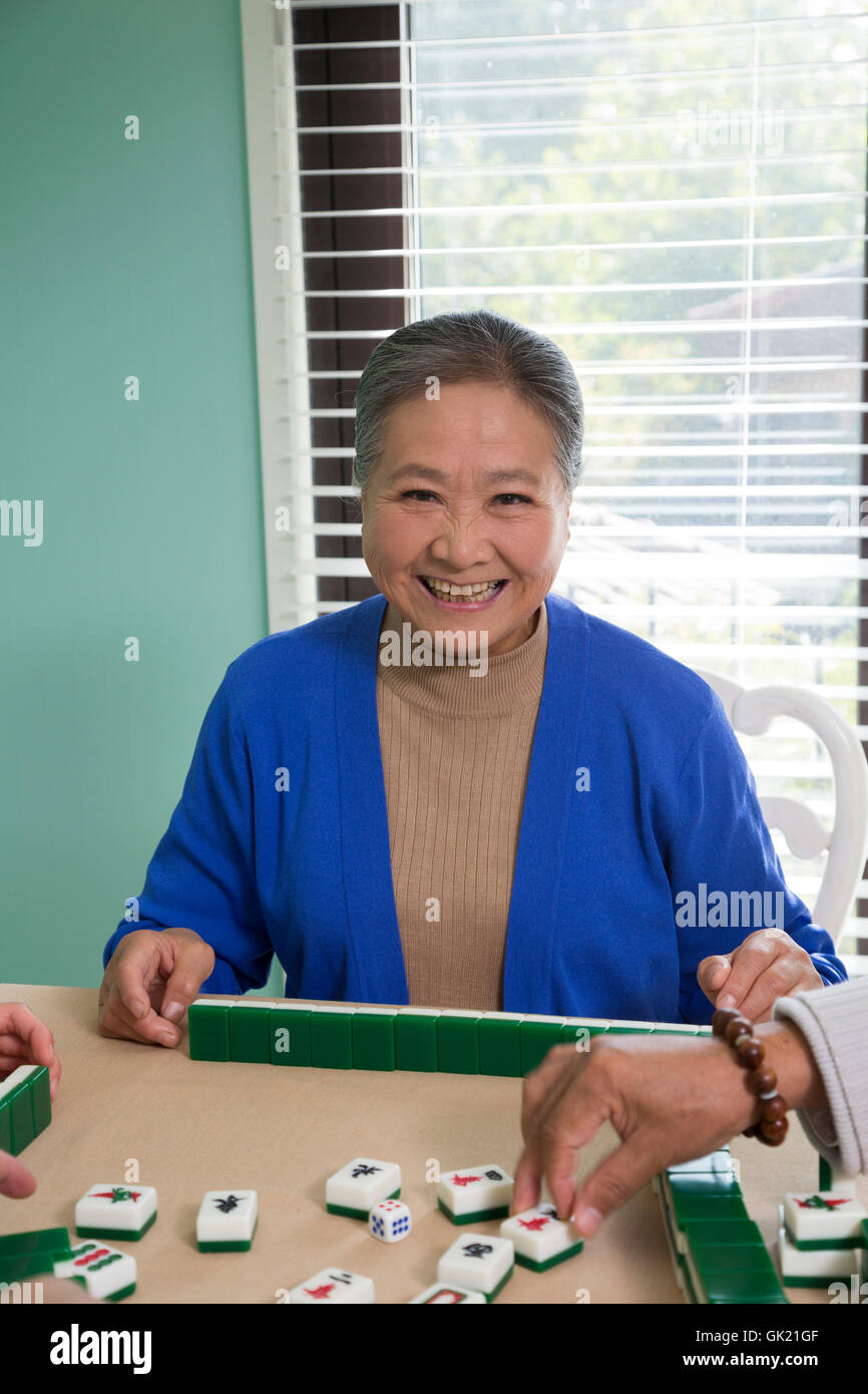 A people playing mahjong Stock Photo - Alamy