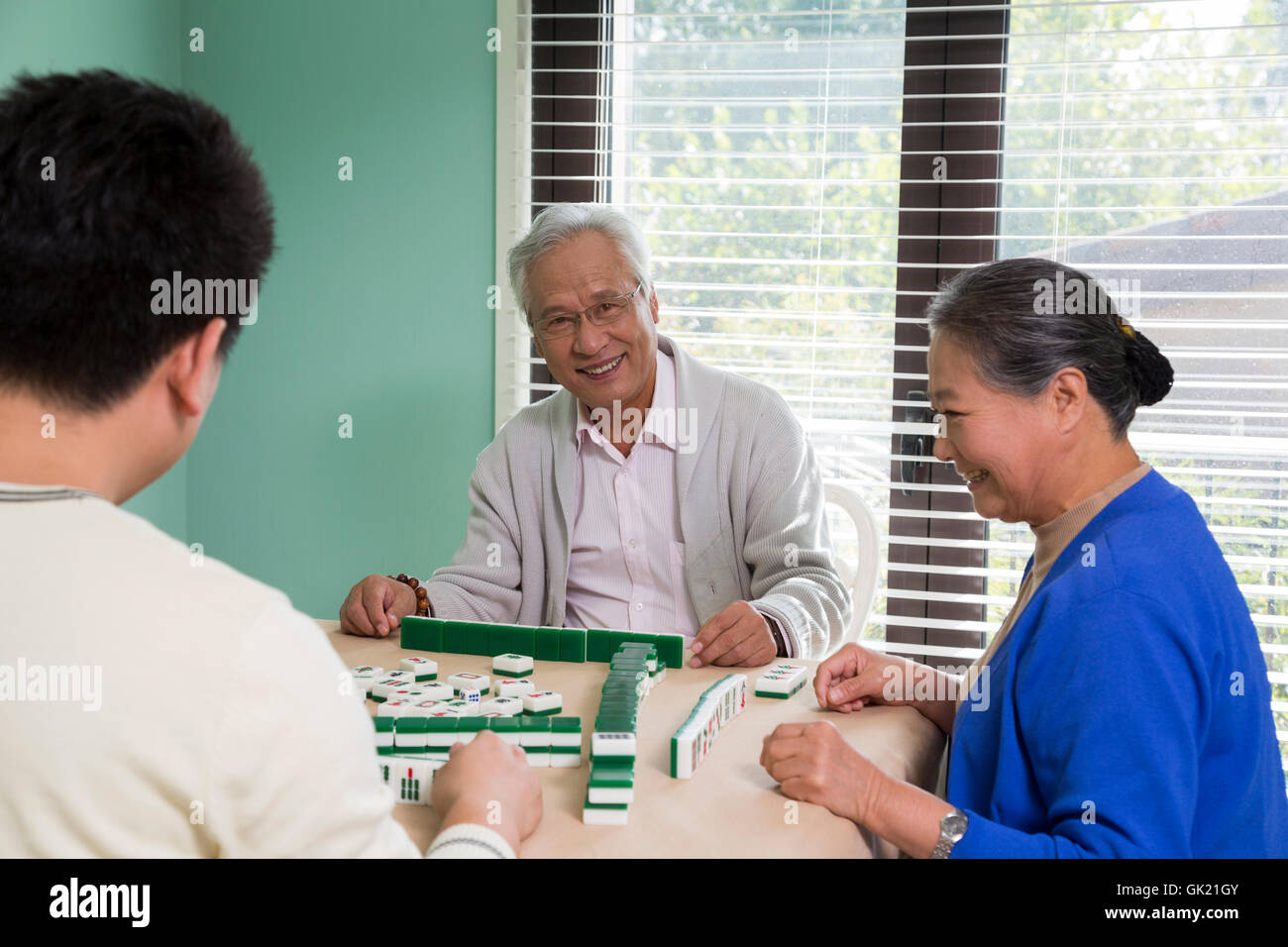 A people playing mahjong Stock Photo - Alamy