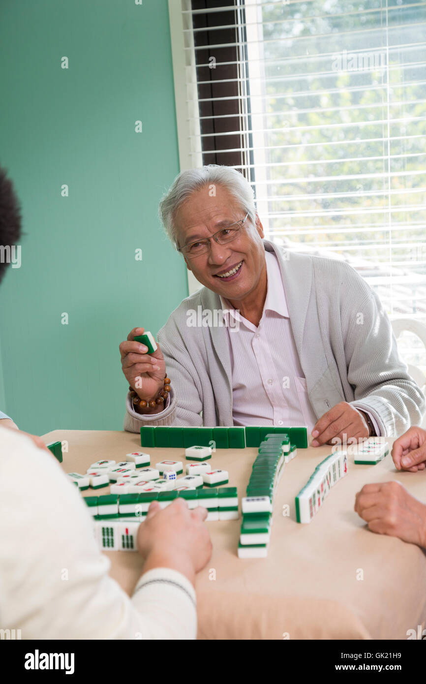 A people playing mahjong Stock Photo - Alamy