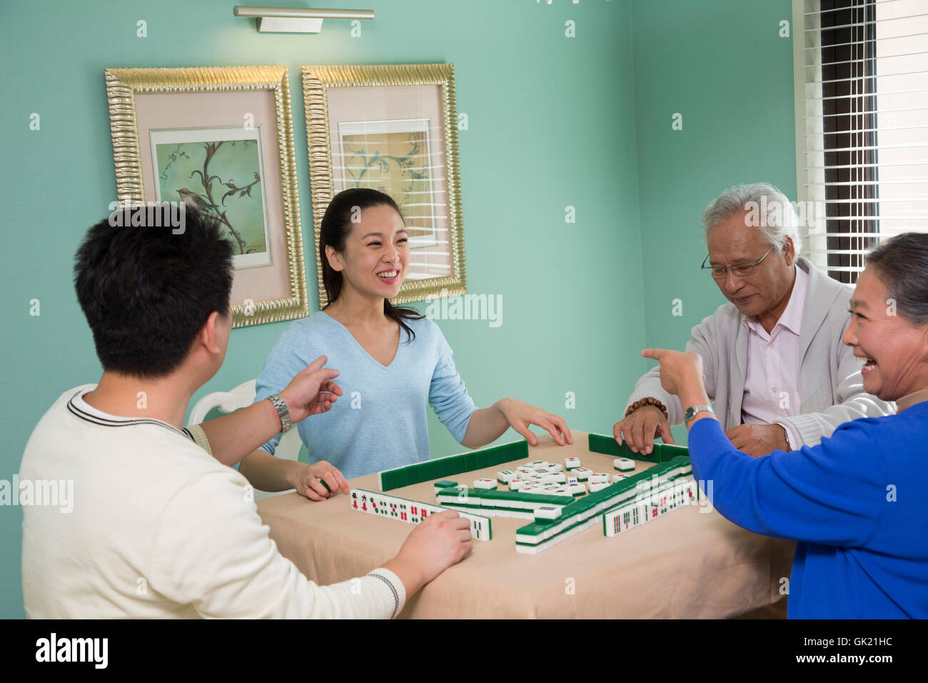 A people playing mahjong Stock Photo - Alamy