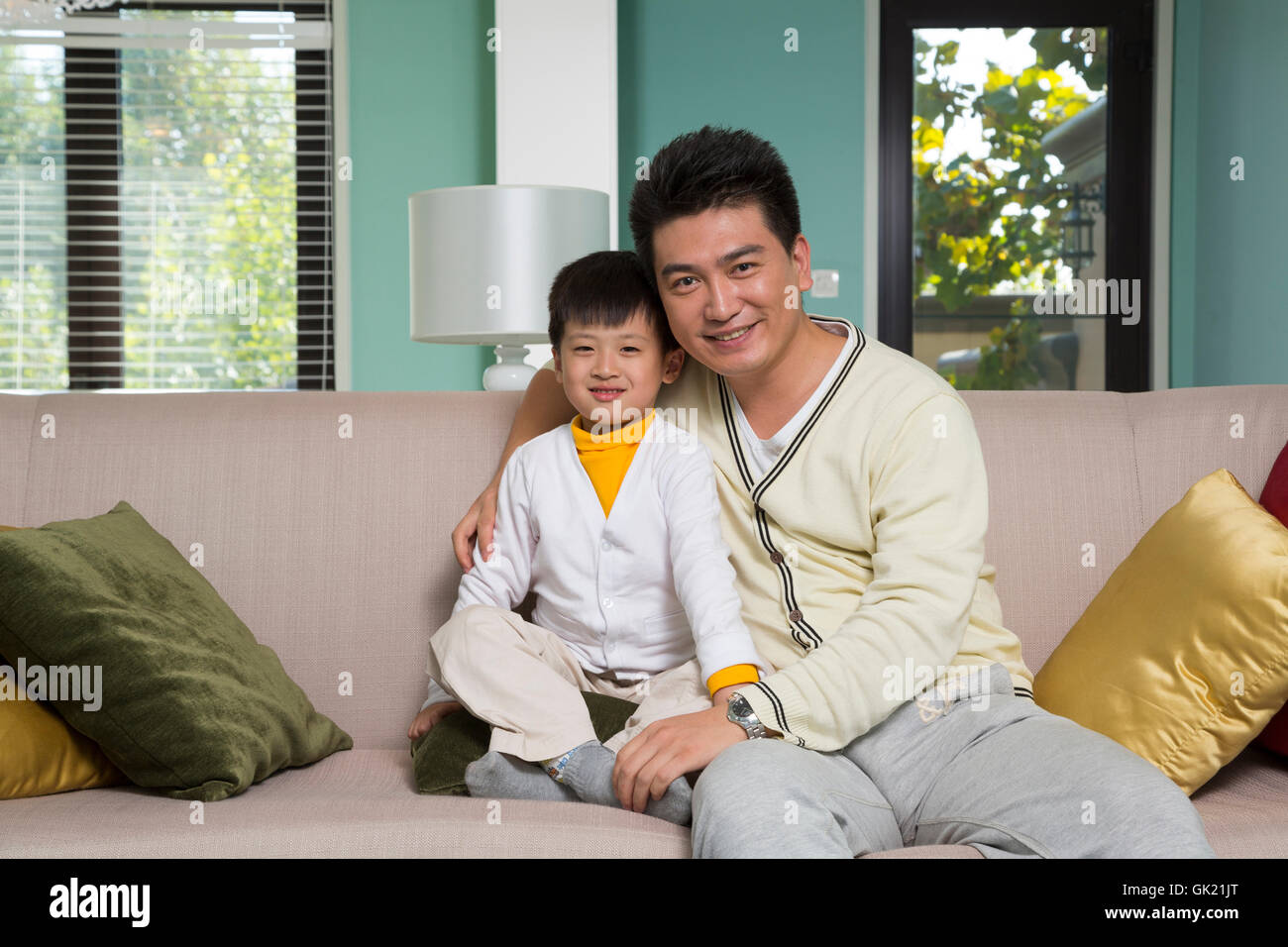 Father and son in the living room Stock Photo - Alamy