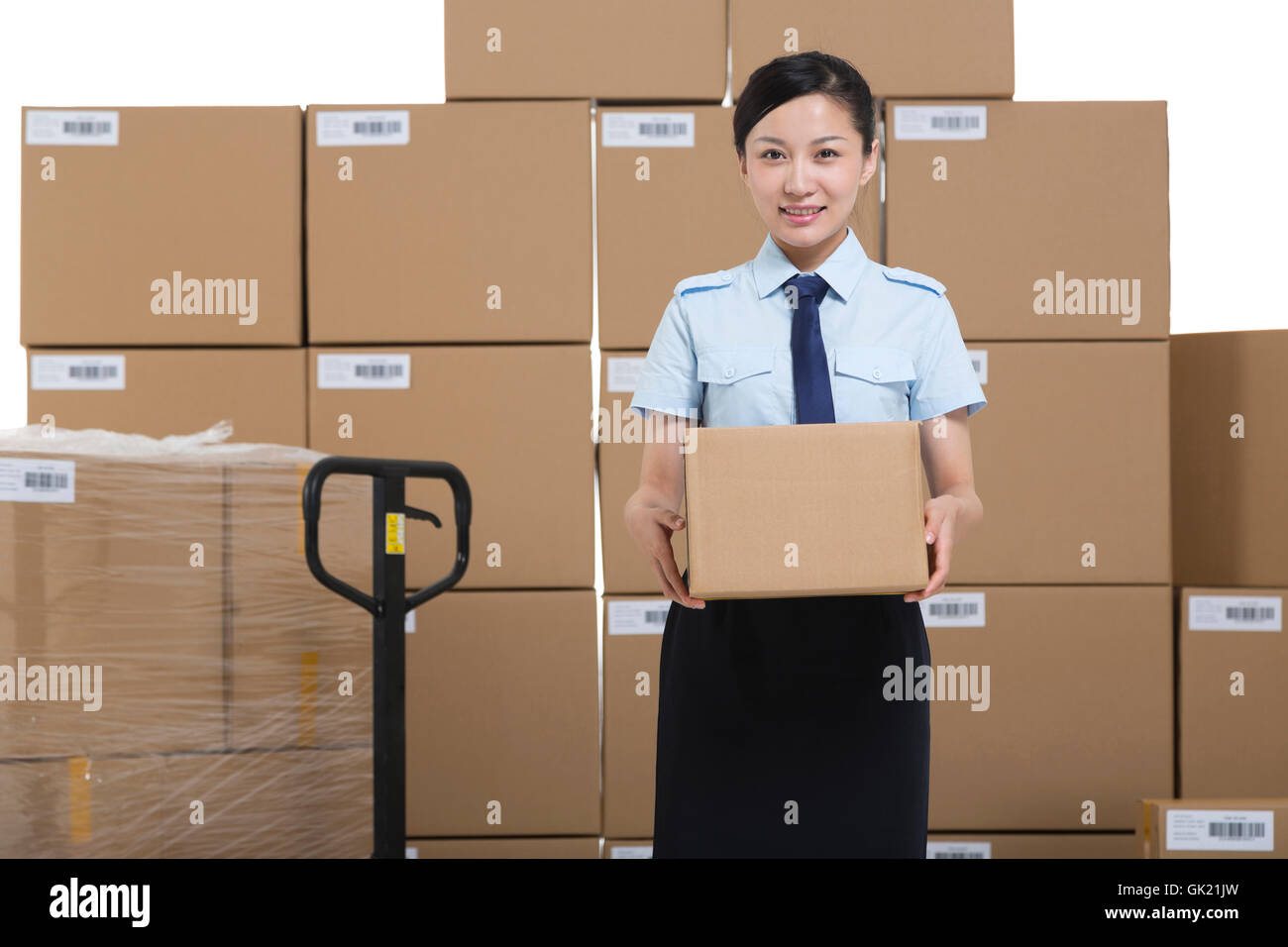 Logistics warehouse workers holding cardboard boxes Stock Photo - Alamy