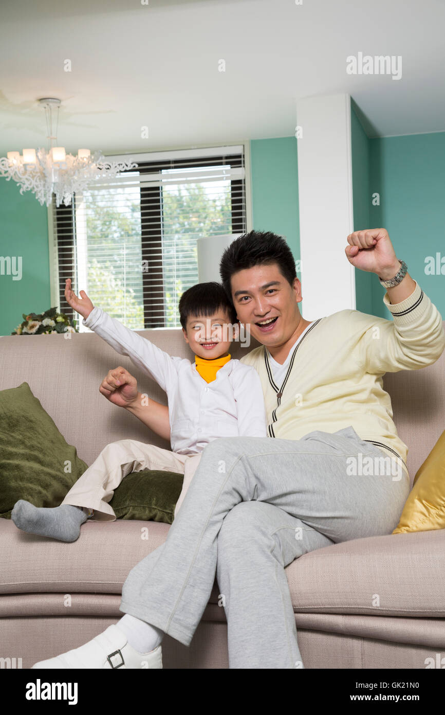 Father and son in the living room Stock Photo - Alamy