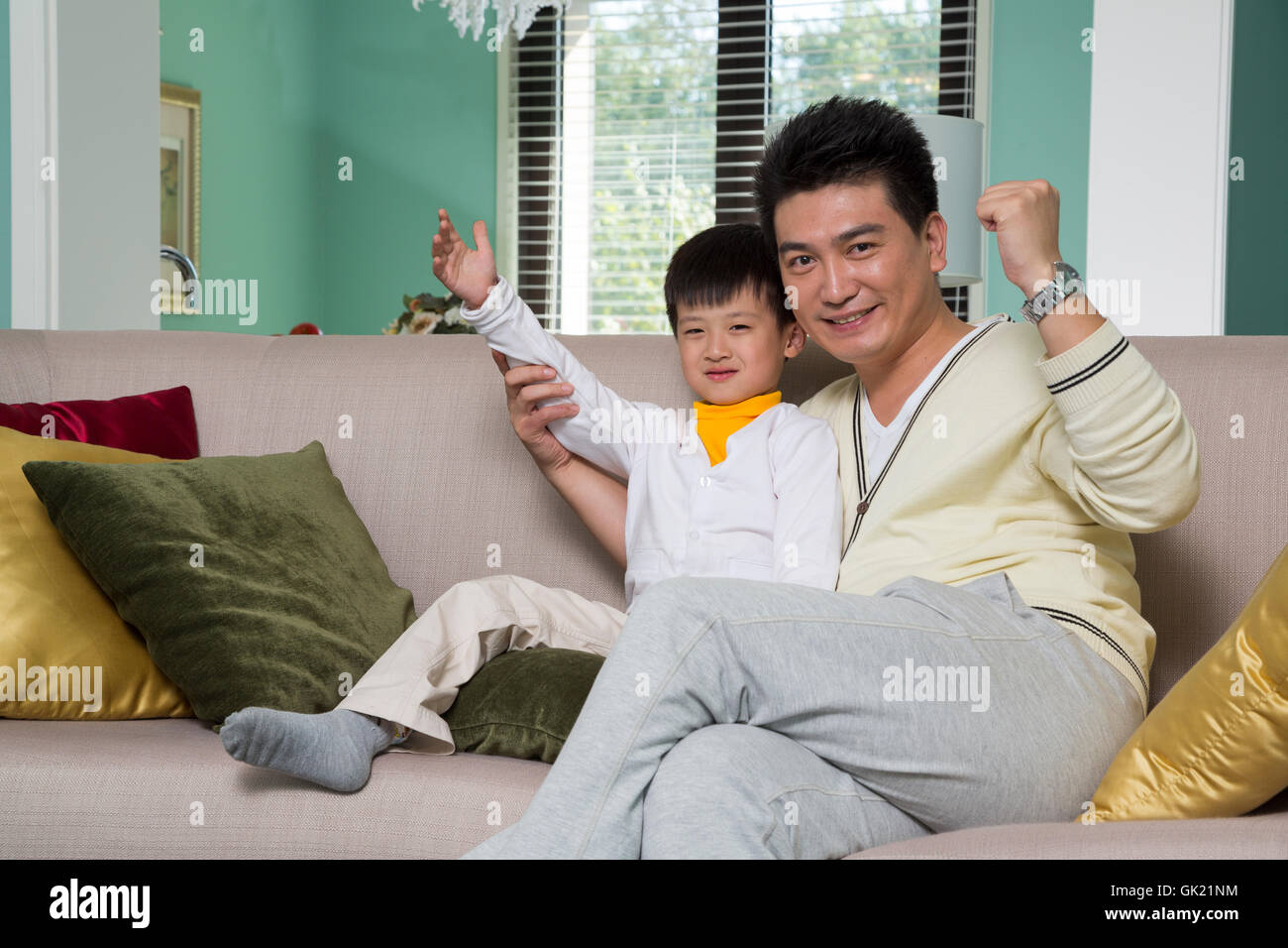 Father and son in the living room Stock Photo - Alamy