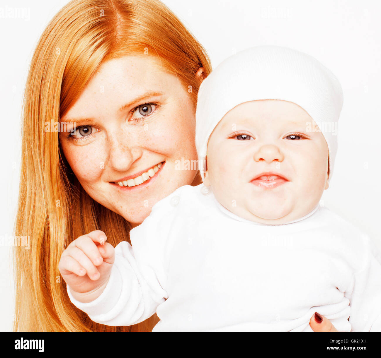 young beauty mother with baby, red head happy family isolated close up ...