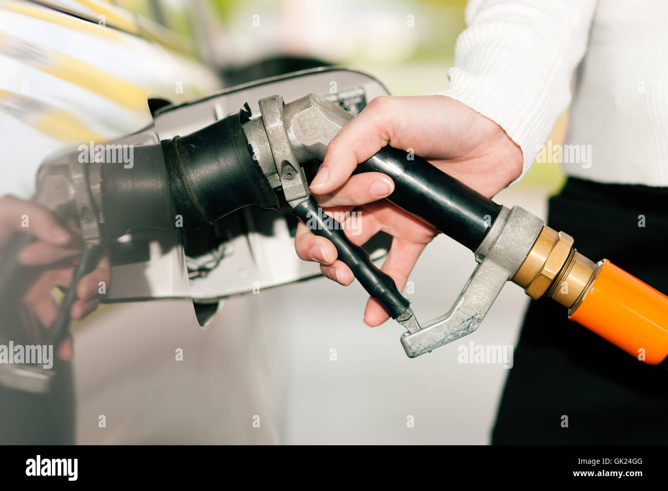 woman hand gas Stock Photo - Alamy