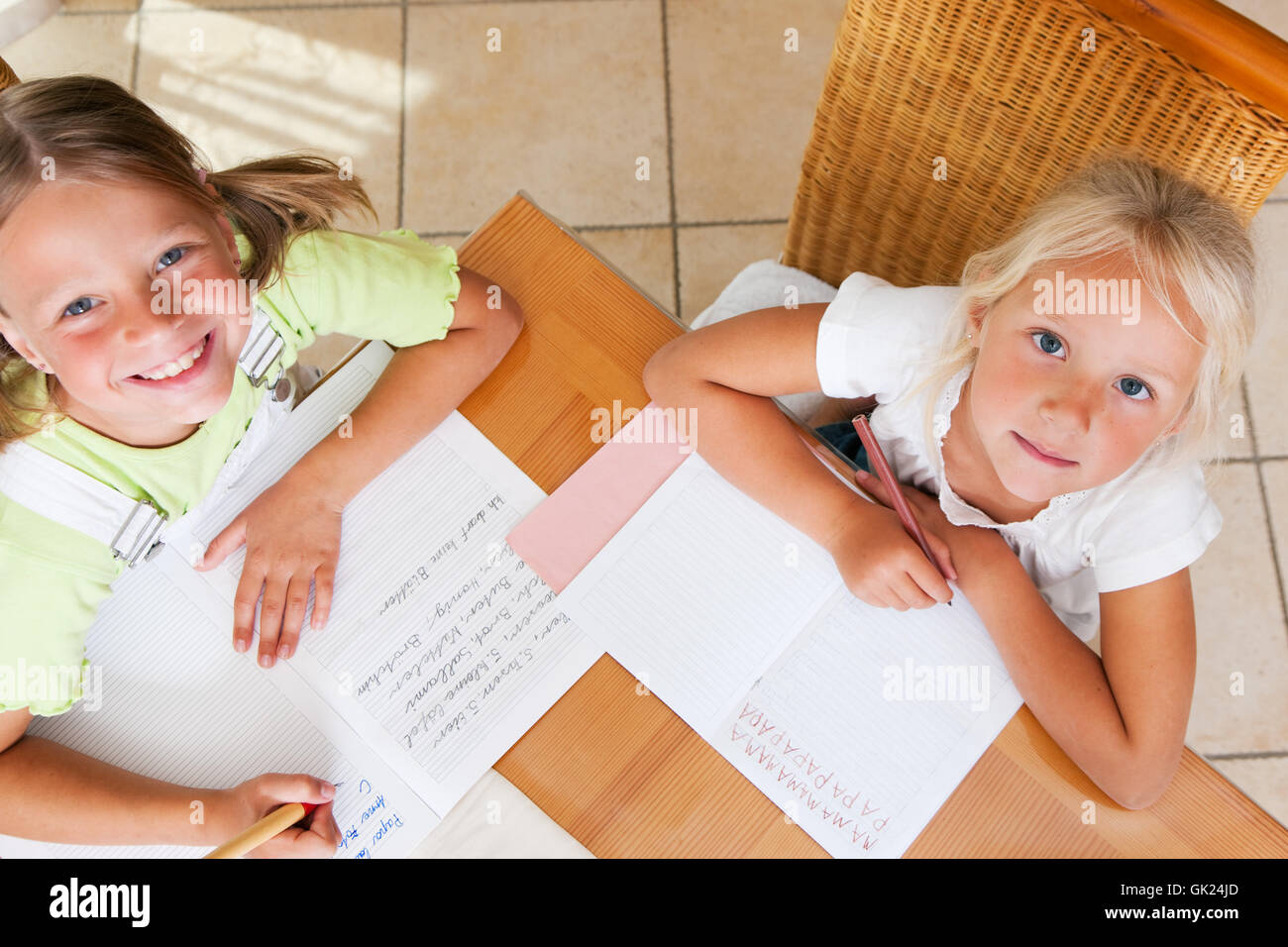 children do homework in kitchen Stock Photo - Alamy