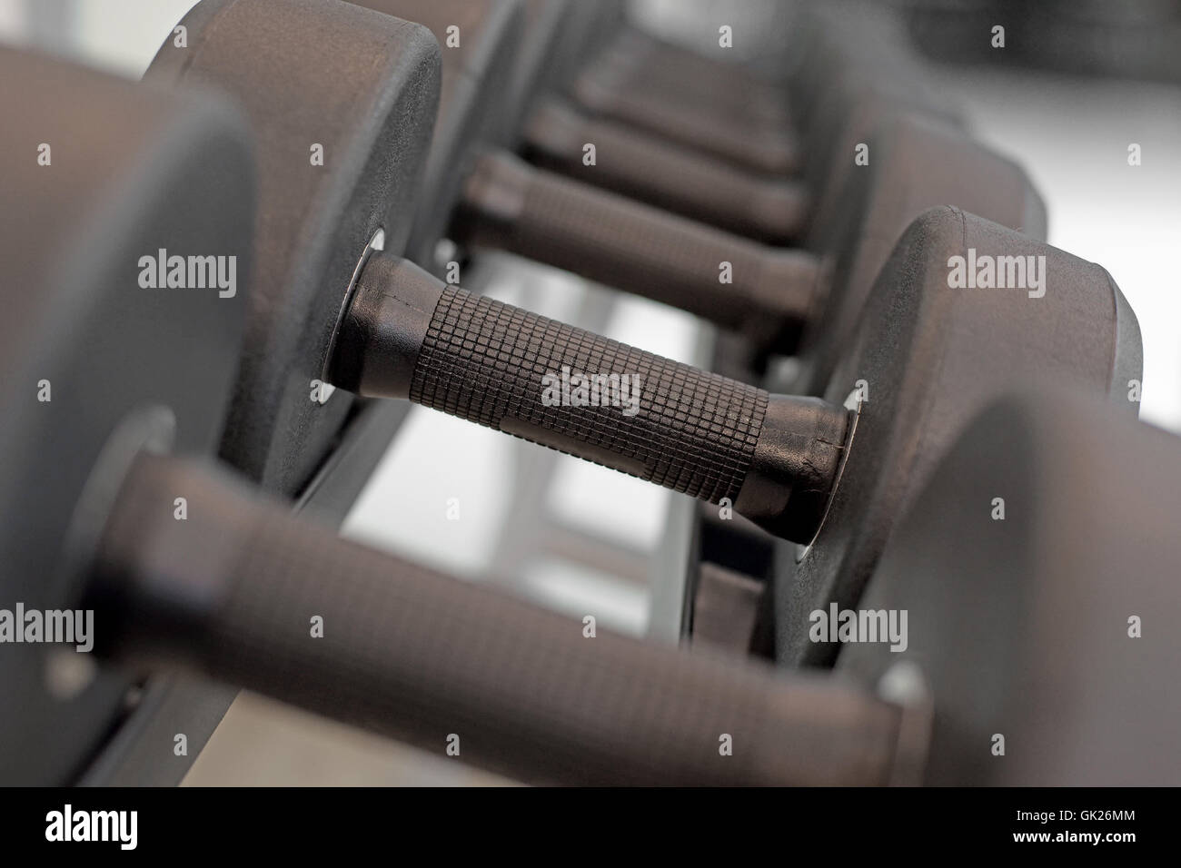 lifting weight, rows of sports dumbbells in the gym Stock Photo - Alamy