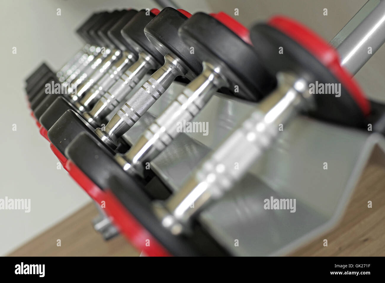 lifting weight, rows of sports dumbbells in the gym Stock Photo - Alamy