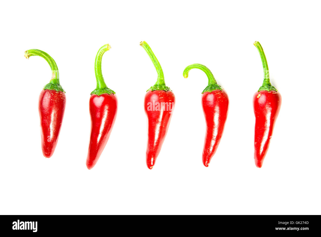 Five ripe red Chilli peppers on over white Stock Photo - Alamy