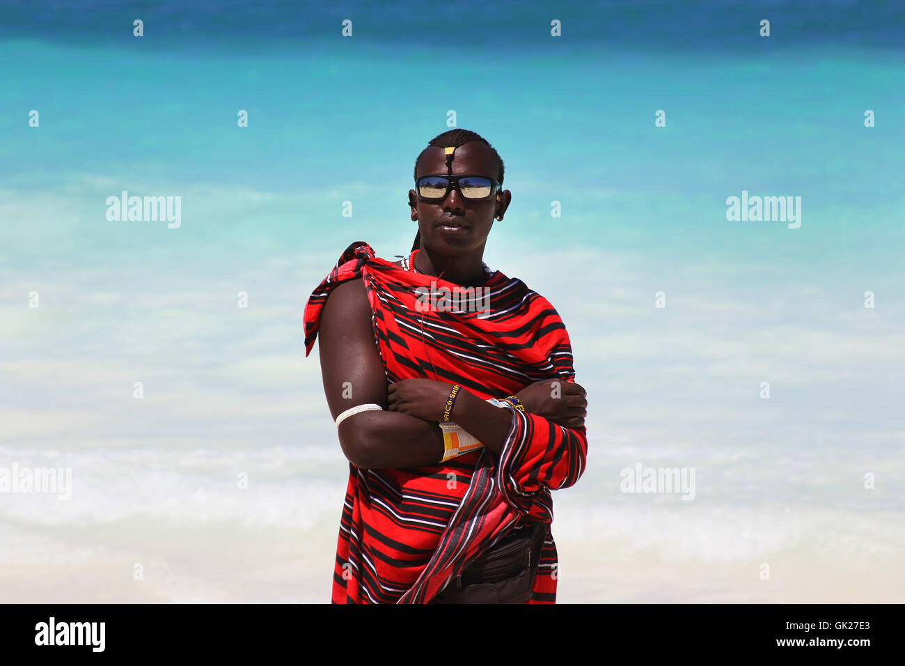 Young massai man with colorful traditional clothes Stock Photo - Alamy