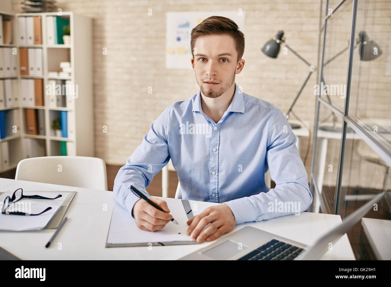 Businessman at workplace Stock Photo - Alamy