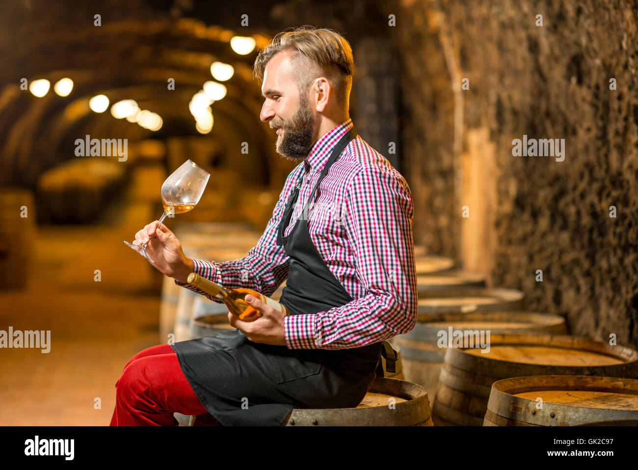 Sommelier in the wine cellar Stock Photo - Alamy