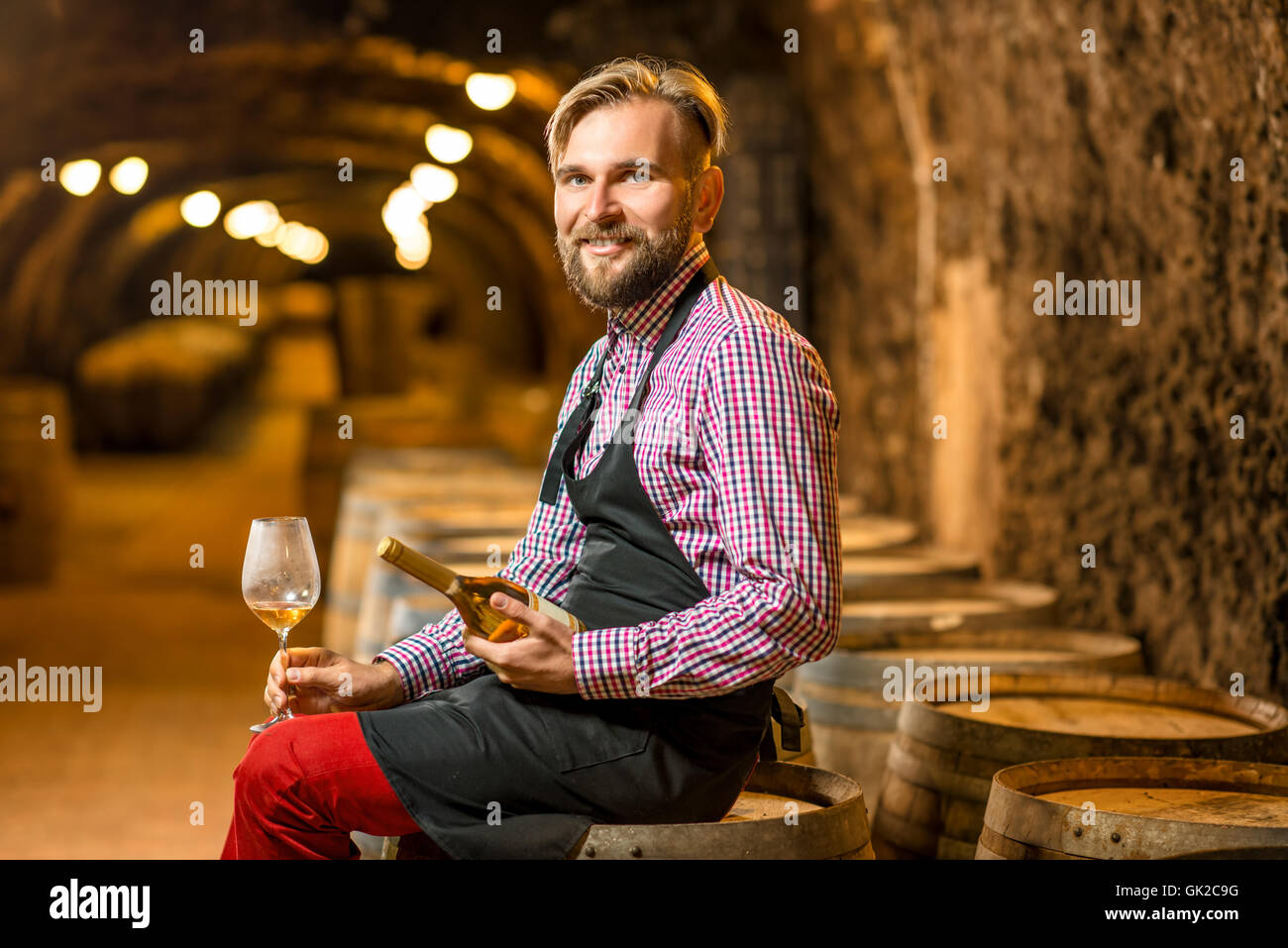 Portrait of a sommelier in the wine cellar Stock Photo - Alamy
