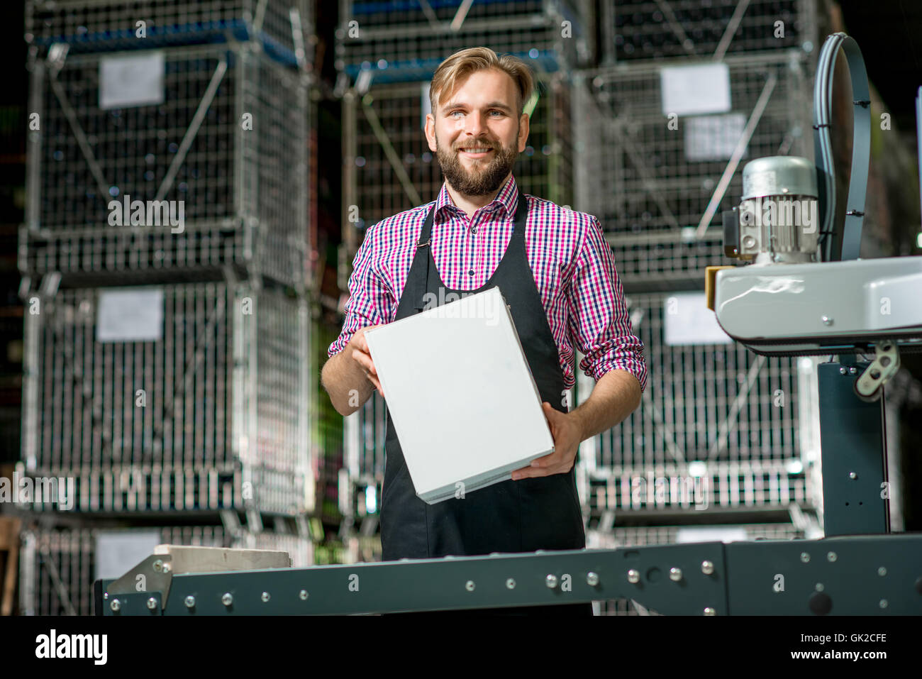 Packer on the packaging line Stock Photo - Alamy
