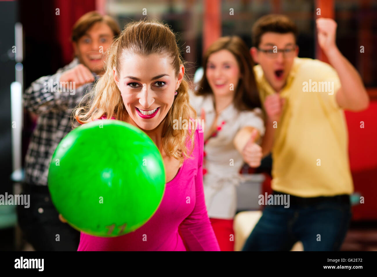 friends bowling in bowling alley Stock Photo - Alamy