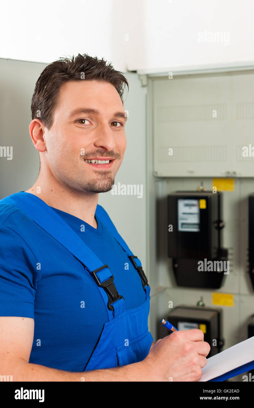 technician reads the electricity meter Stock Photo - Alamy