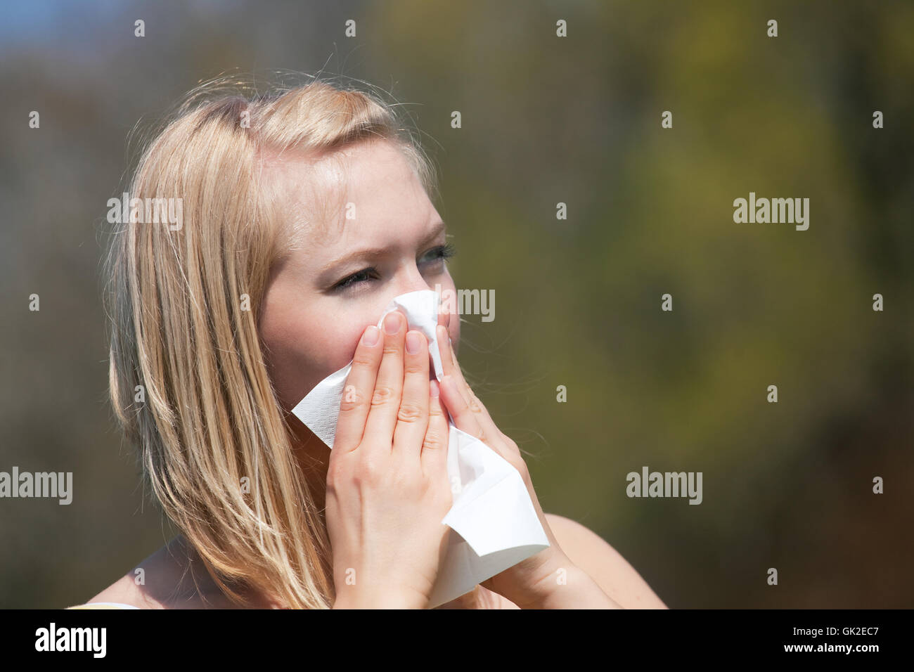 woman with hay fever sneezing Stock Photo - Alamy