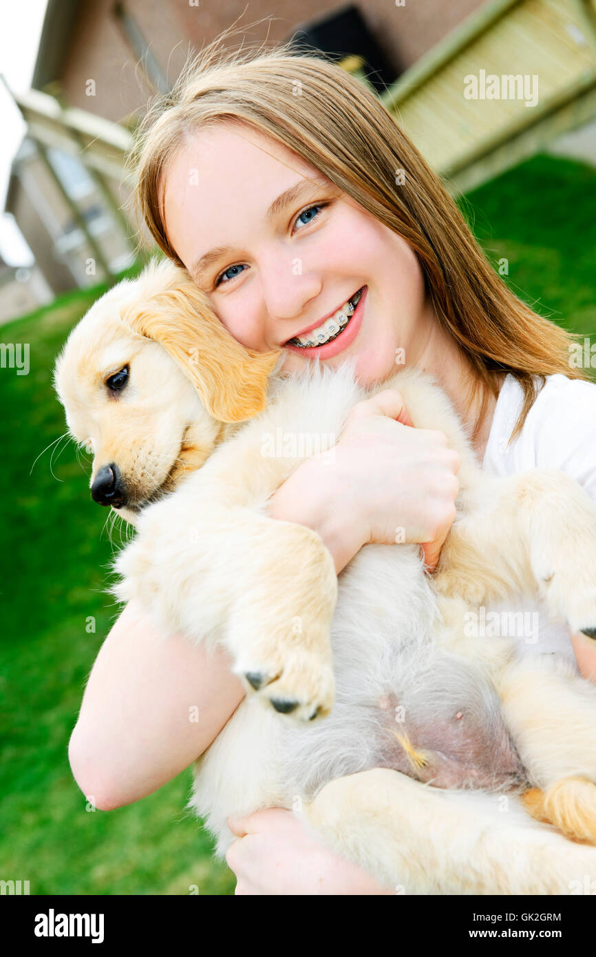 Laughing teen with dog hi-res stock photography and images - Alamy