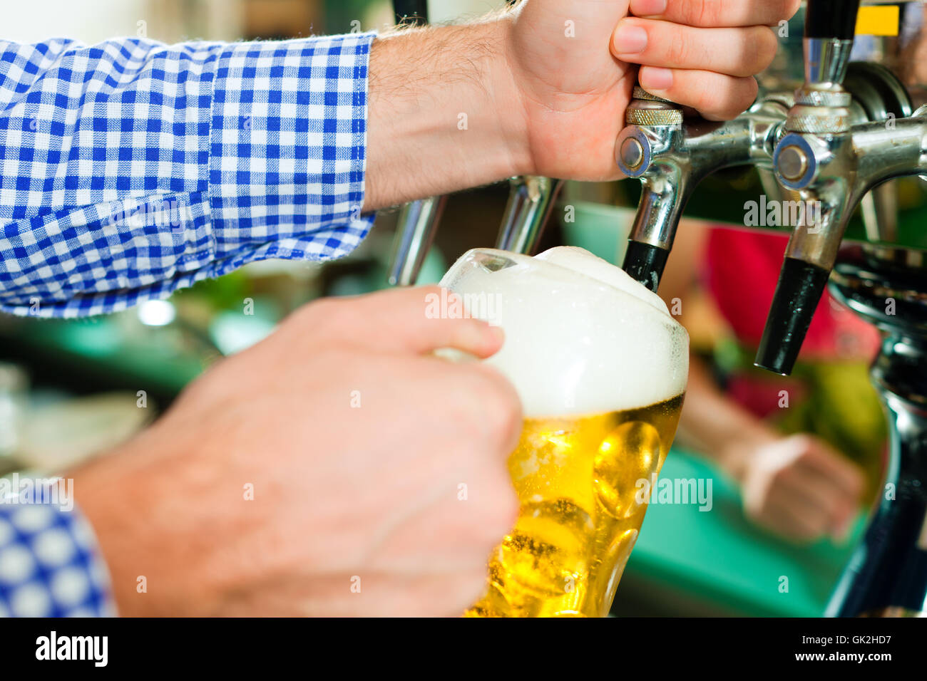 man pulling beer Stock Photo - Alamy