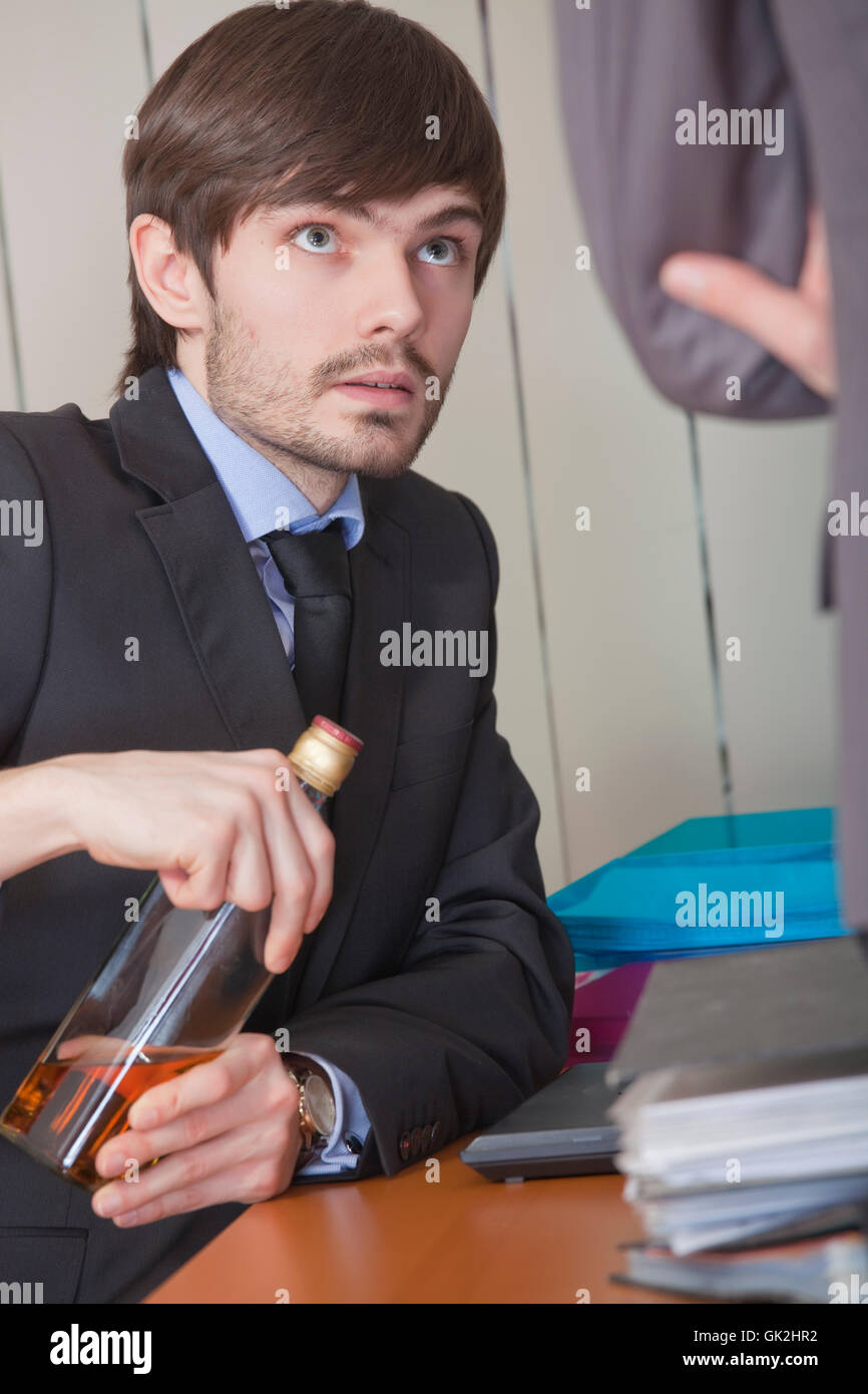 Hiding alcohol at work desk hi-res stock photography and images - Alamy