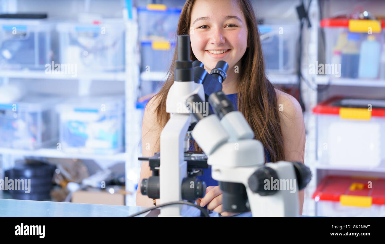 Female Teenage Student In Science Class With Experiment, Young Woman ...