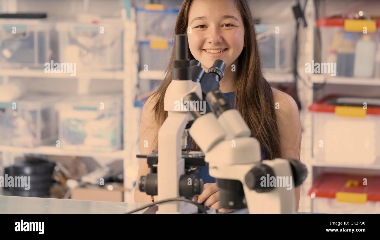 Female Teenage Student In Science Class With Experiment, Young Woman ...