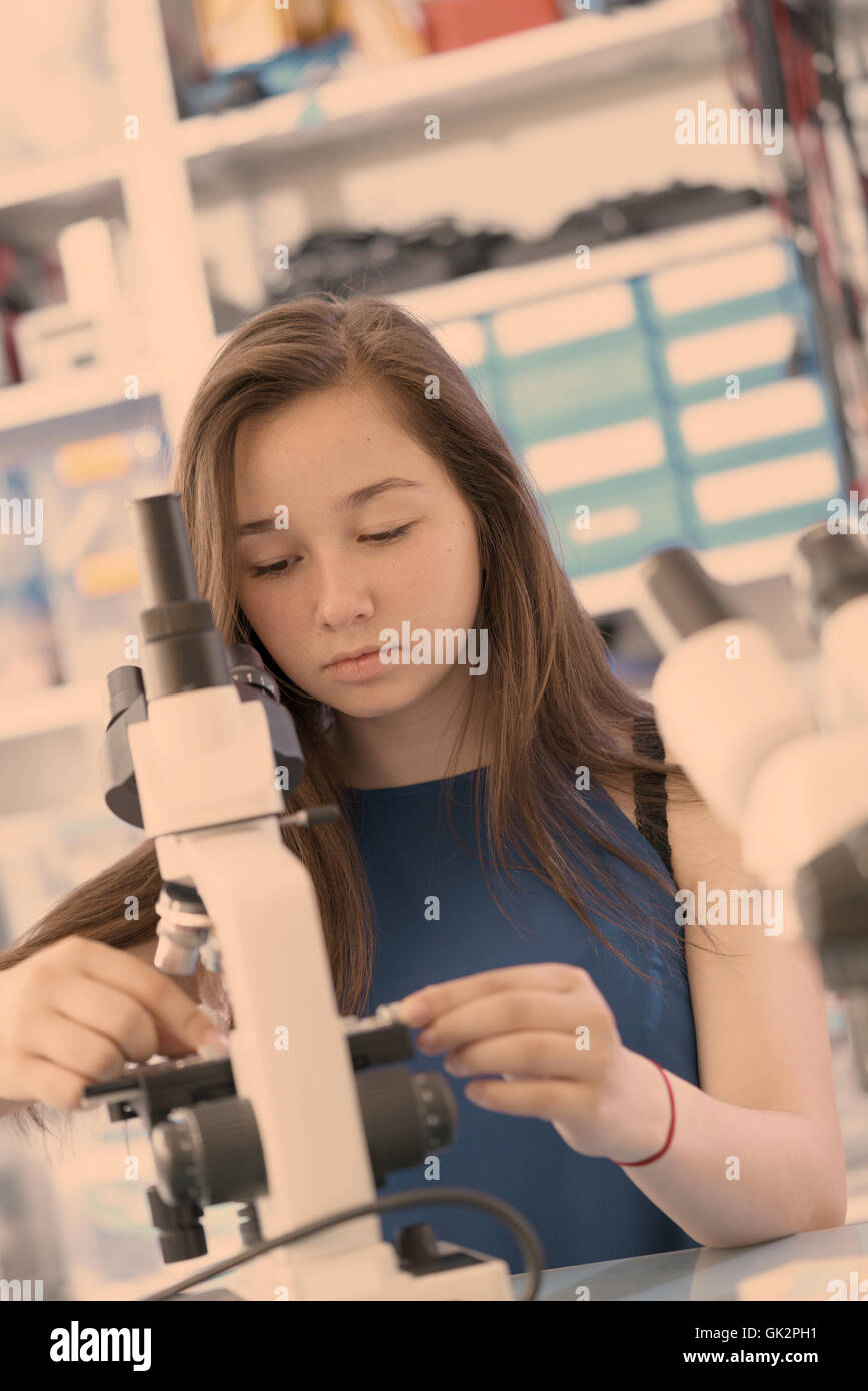Female Teenage Student In Science Class With Experiment, Young Woman ...