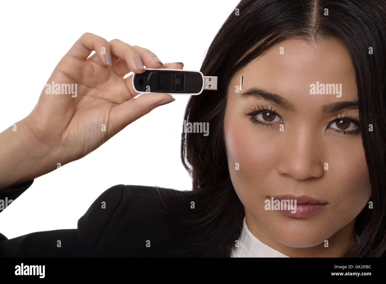 business woman plugging a usb hard drive into her brain Stock Photo - Alamy