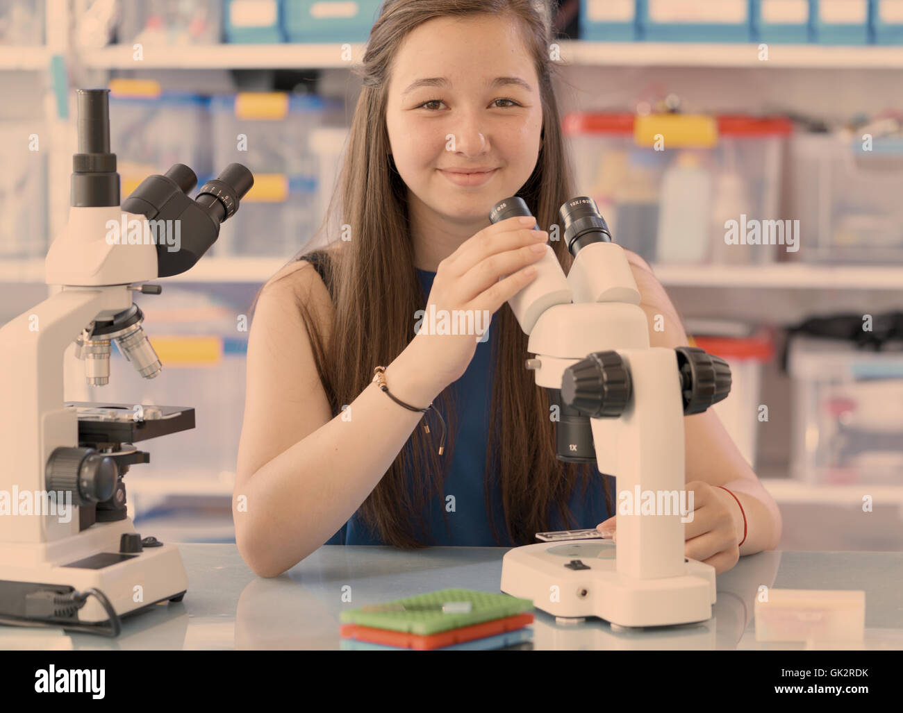 Female Teenage Student In Science Class With Experiment, Young Woman ...