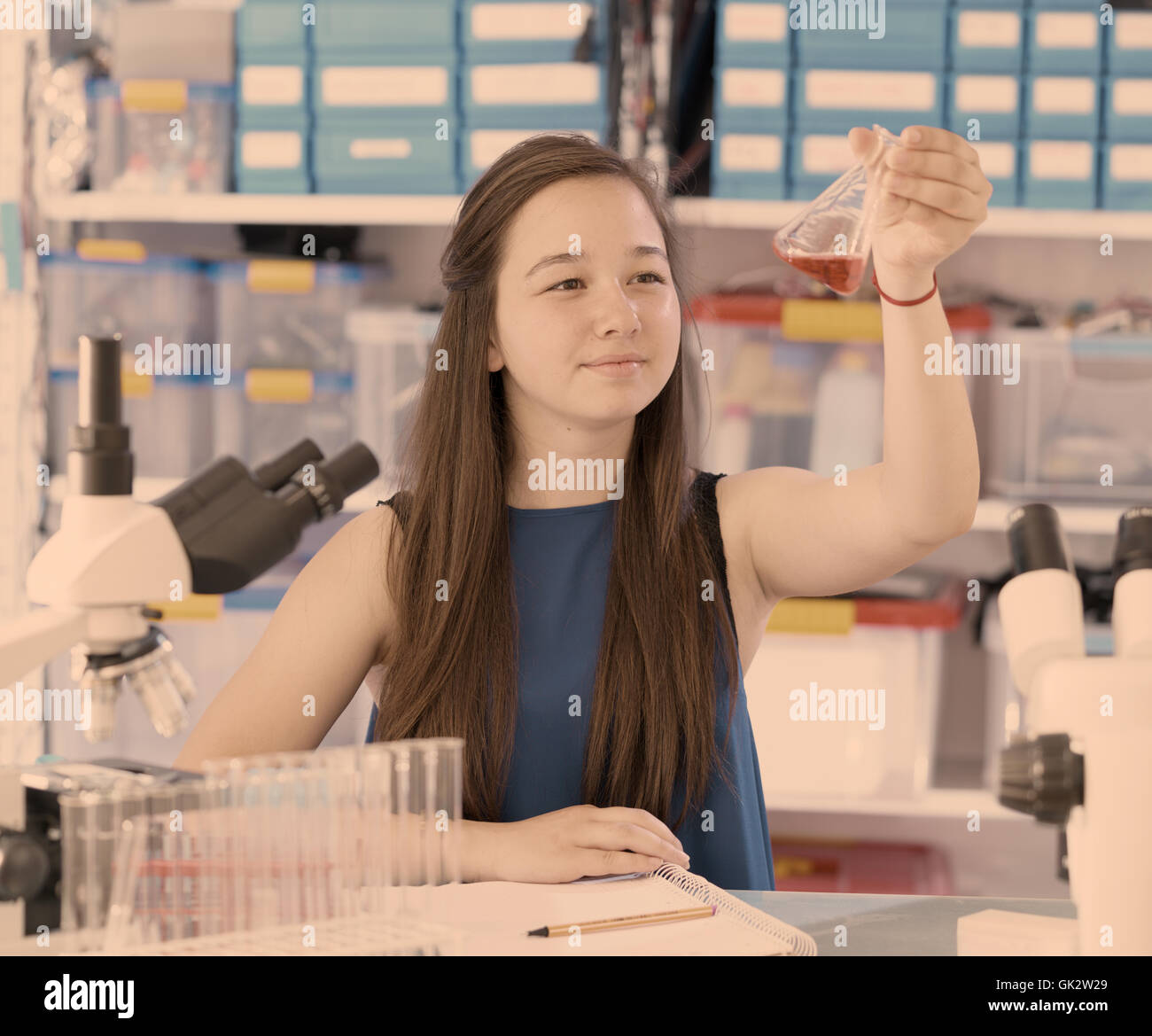 Female Teenage Student In Science Class With Experiment, Young Woman ...