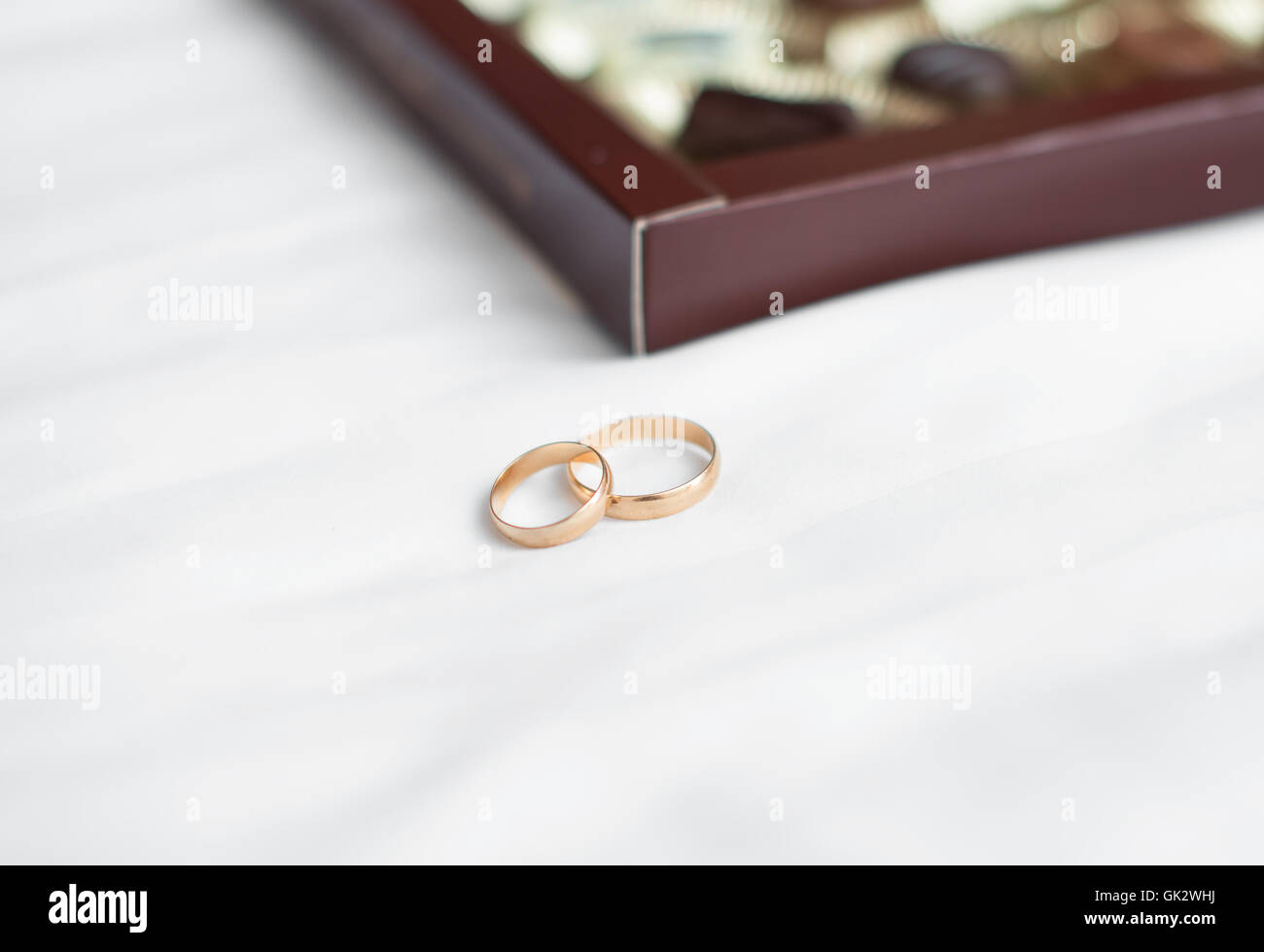 Two wedding rings on the bed Stock Photo - Alamy