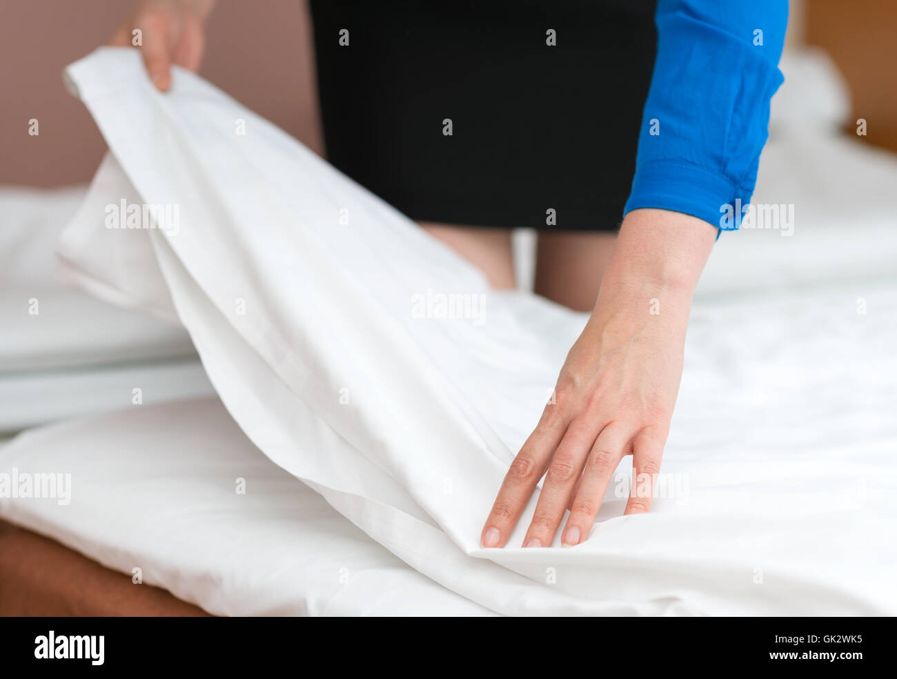 Room service. Woman making bed in hotel room Stock Photo - Alamy