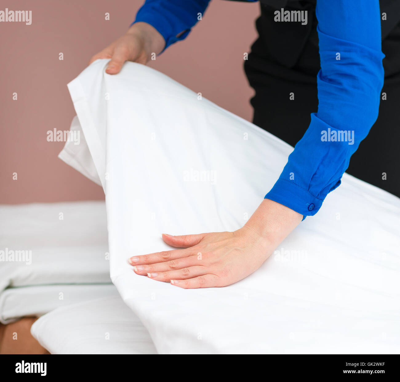 Room service. Woman making bed in hotel room Stock Photo - Alamy