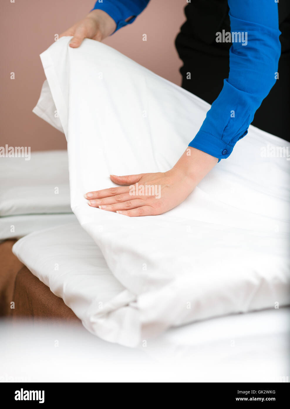 Room service. Woman making bed in hotel room Stock Photo - Alamy